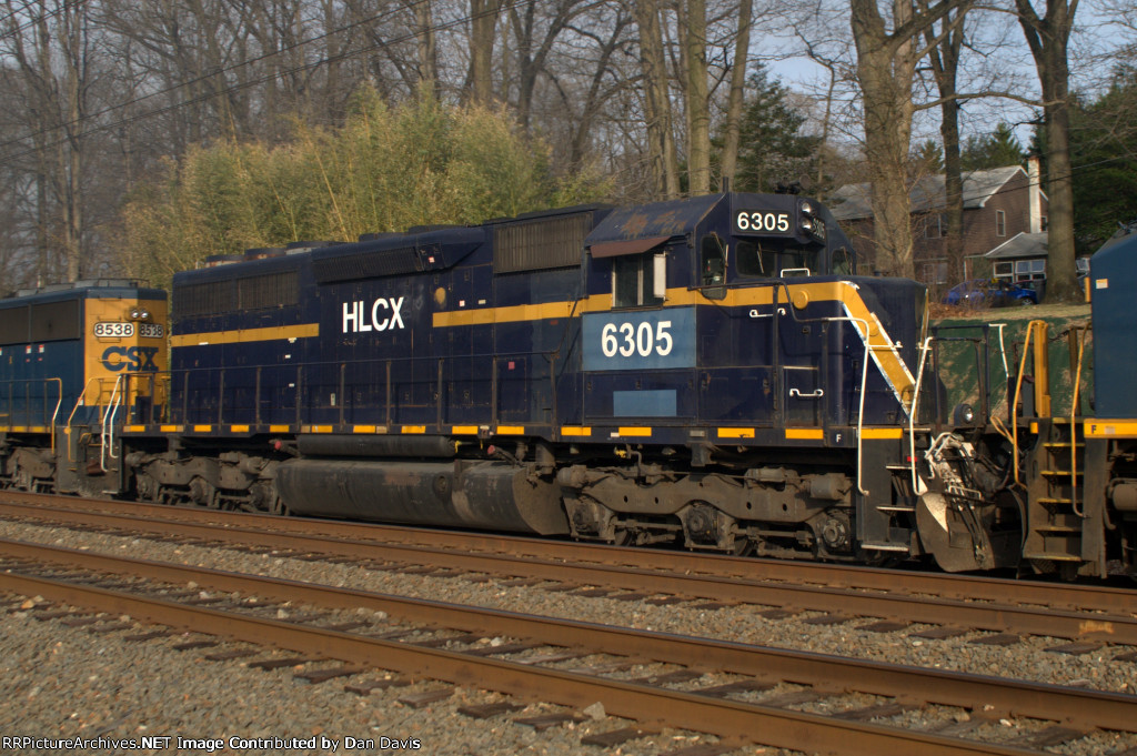 HLCX SD40-2 6305 in MPI blue and gold paint trails on Q702-12